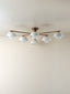 Porsa - 6 light aged brass and warm white porcelain flush